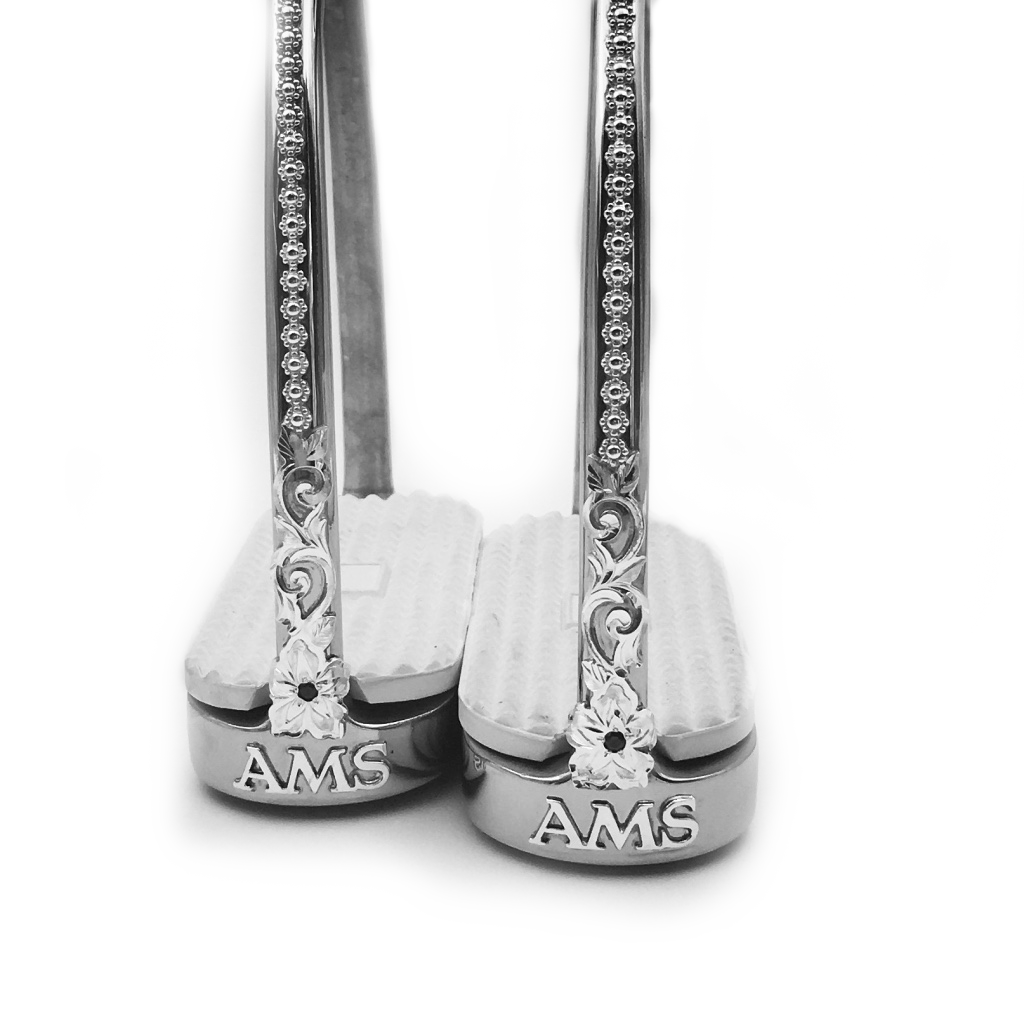 English riding irons adorned with hand engraved silver florals and ...